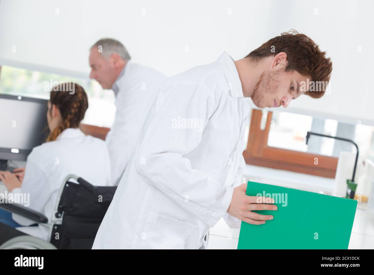 College lab coats hi-res stock photography and images - Alamy