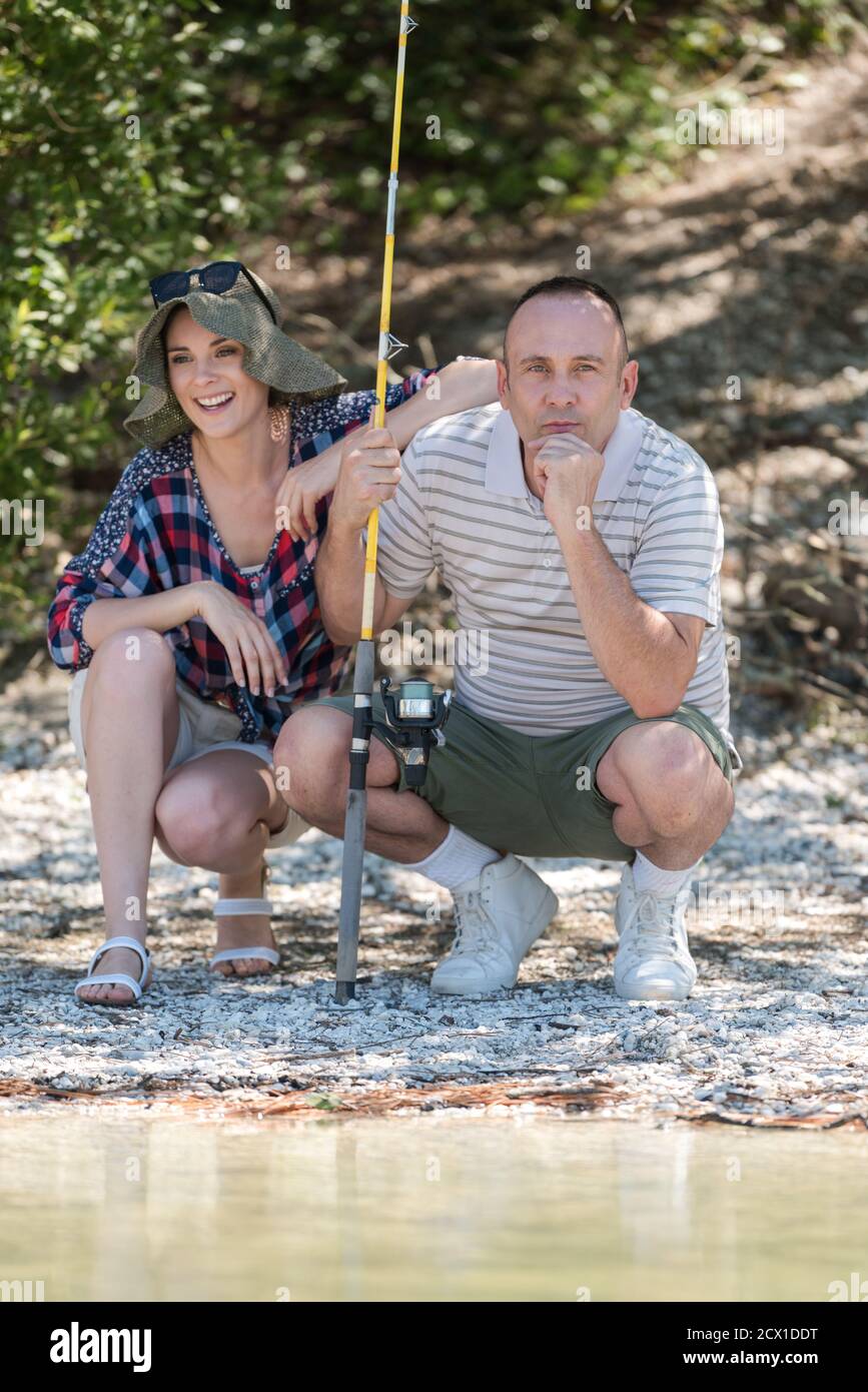 couple fishing on the river Stock Photo - Alamy
