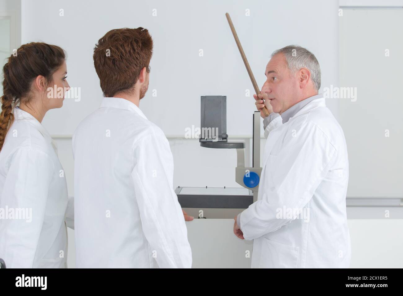 Teacher pointing projector screen hi-res stock photography and images ...