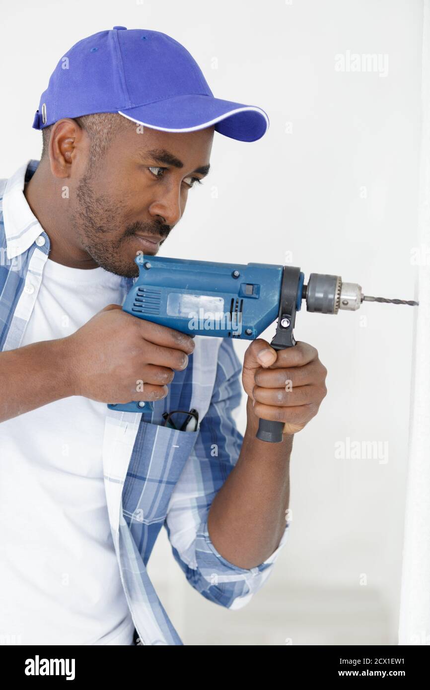 Man using power drill hi-res stock photography and images - Alamy