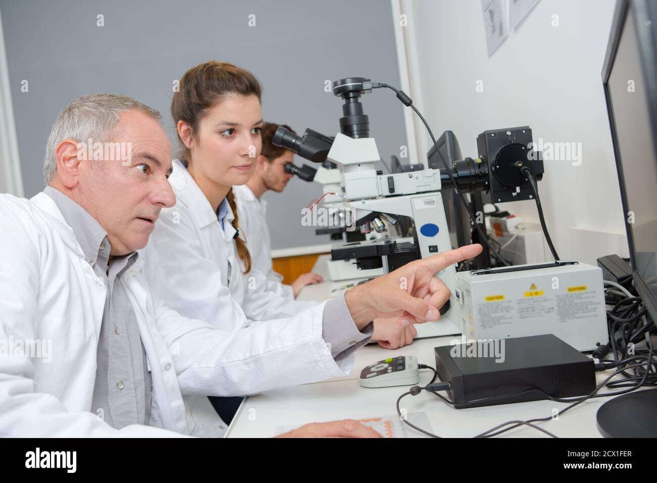 female technical university students in white lab coat Stock Photo - Alamy