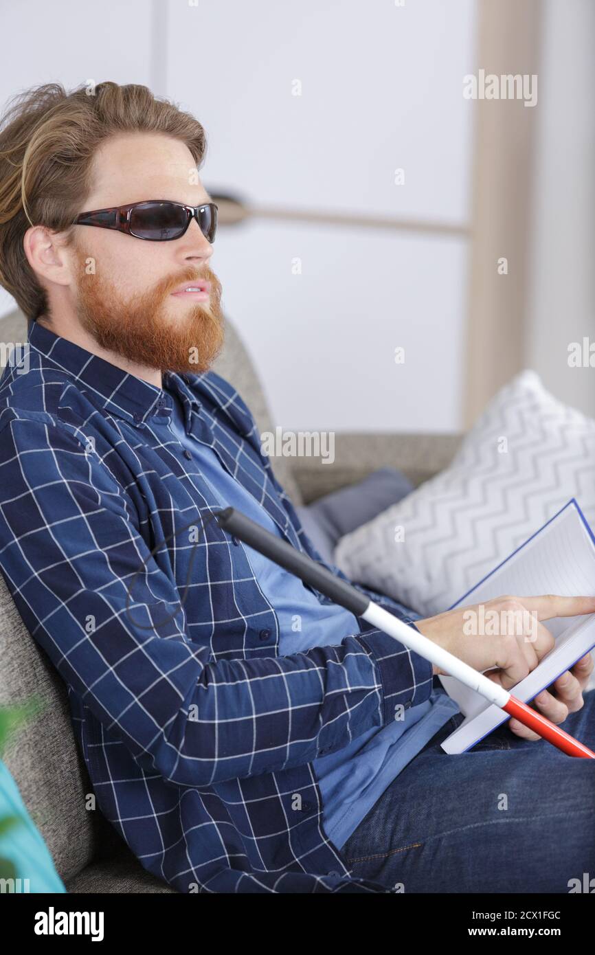 blind man reading braille at home Stock Photo - Alamy