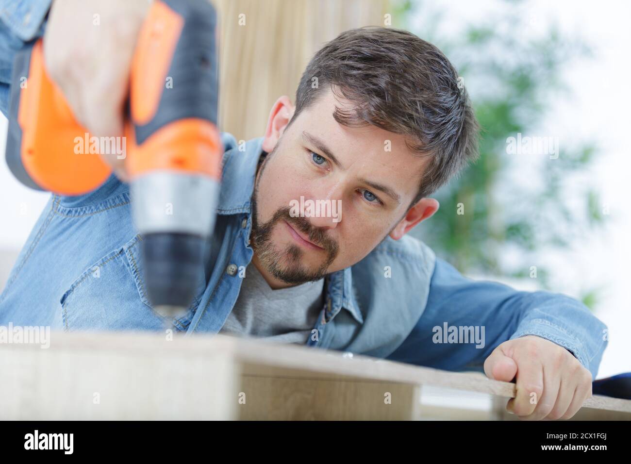 Assembling furniture power tools hi-res stock photography and images ...