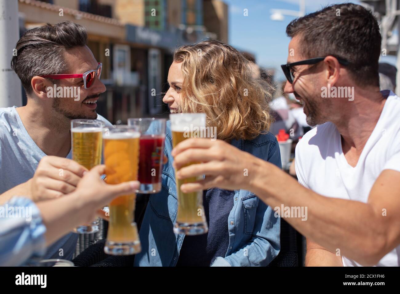 group of people enjoying and cheering beer outdoors Stock Photo - Alamy