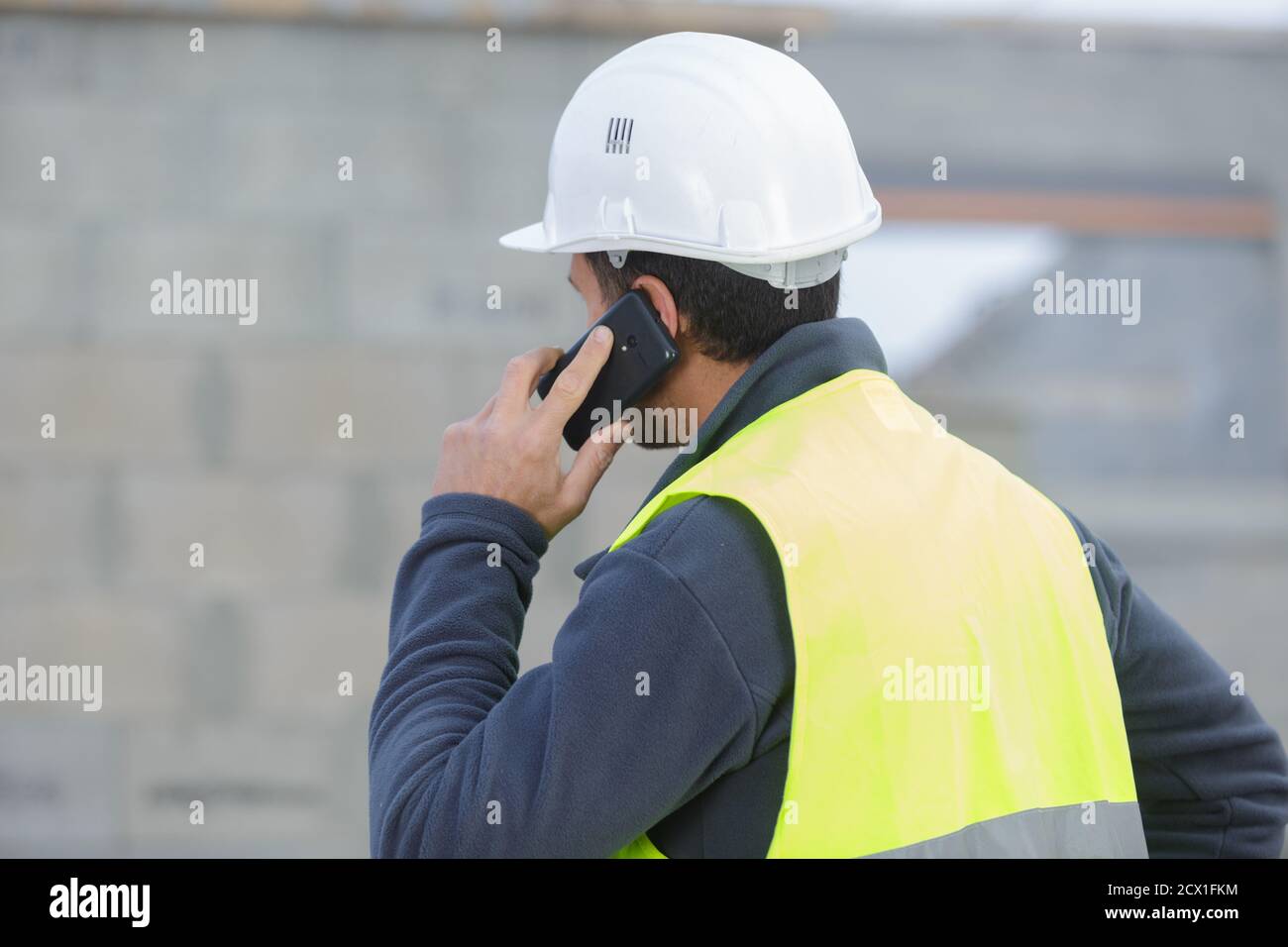 construction worker talking on the phone Stock Photo - Alamy