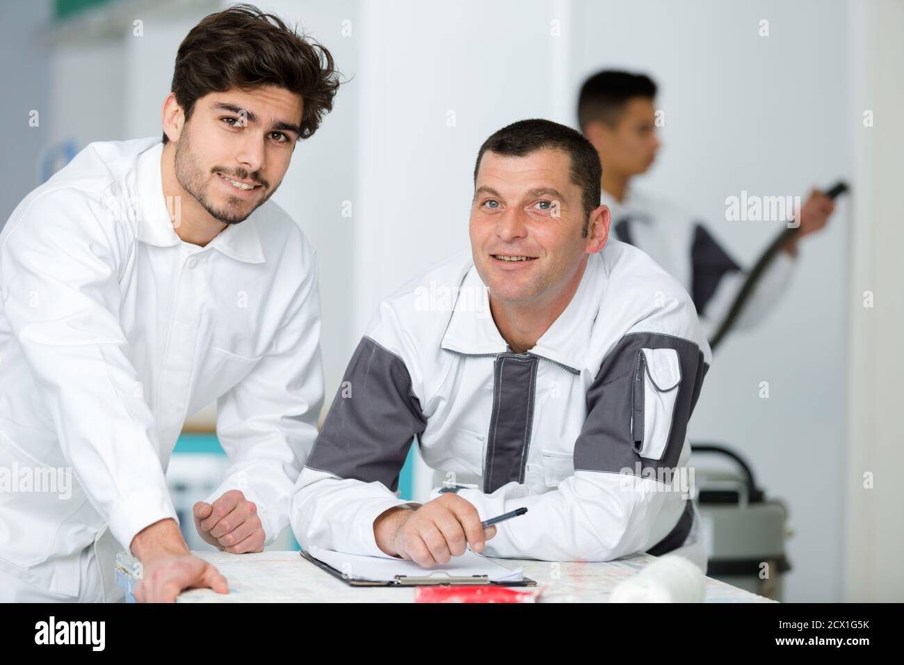 painter with apprentice Stock Photo - Alamy