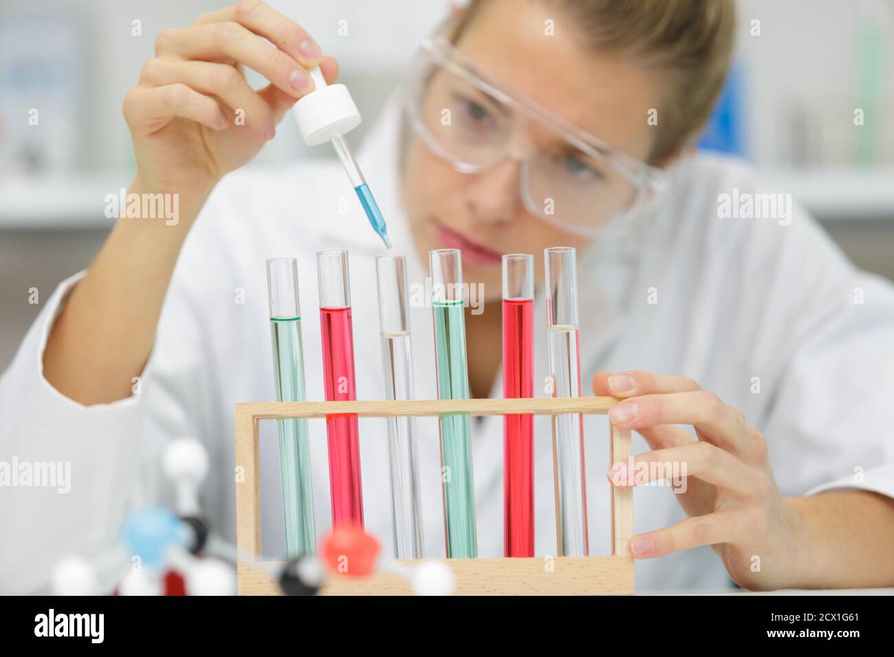 woman with pipettes in lab Stock Photo - Alamy