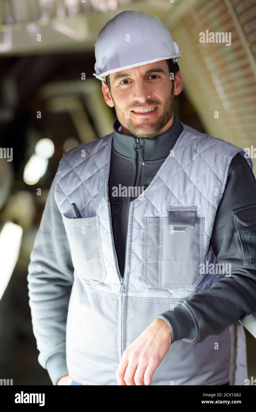 portrait of a male laborer posing smiling Stock Photo - Alamy