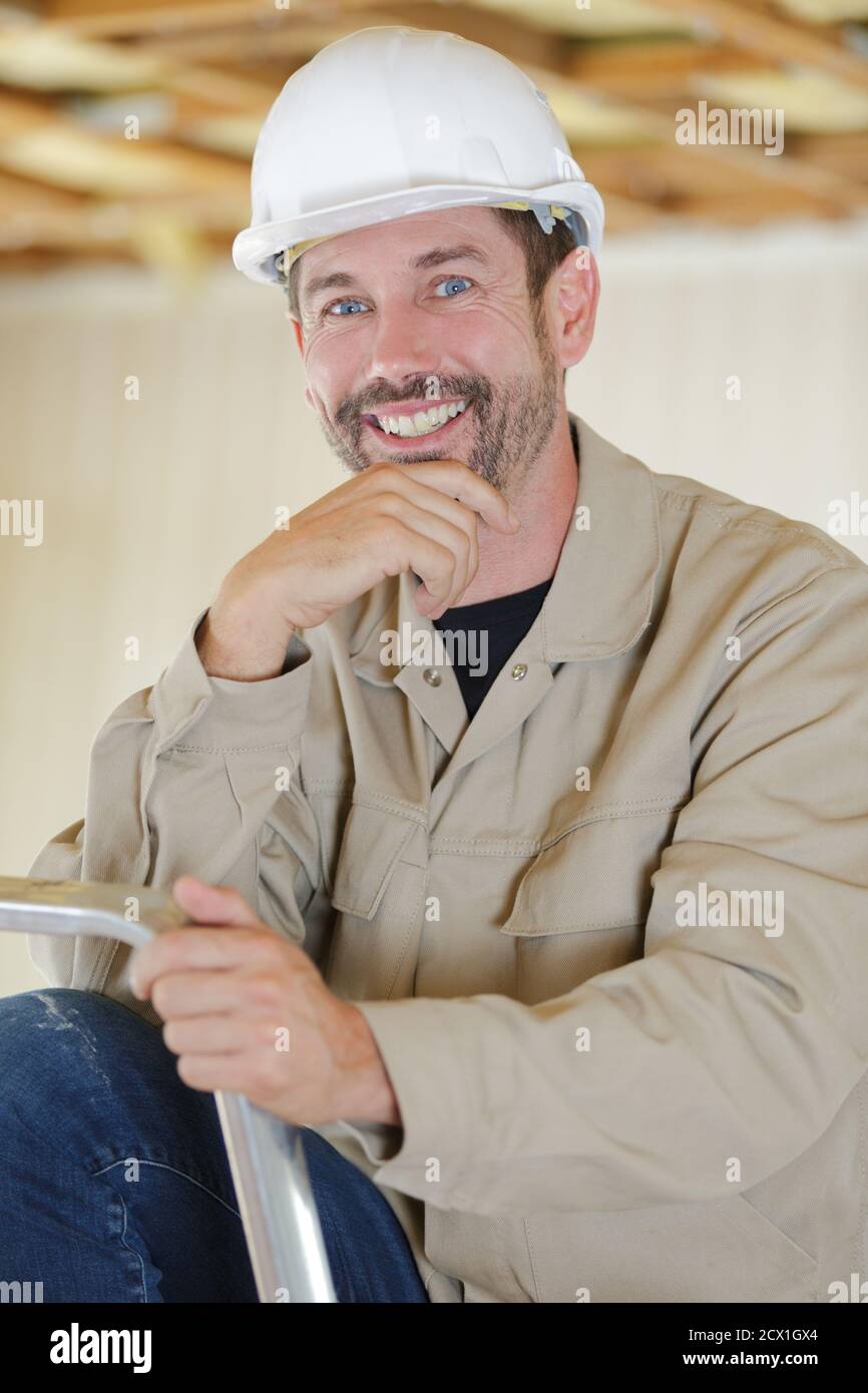 happy builder smiling at camera Stock Photo - Alamy
