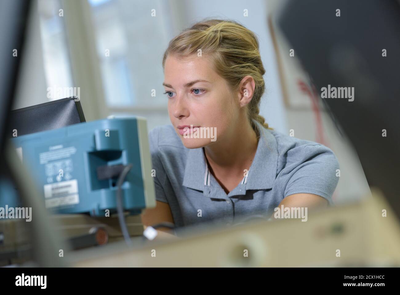 working on an electronic machine Stock Photo - Alamy