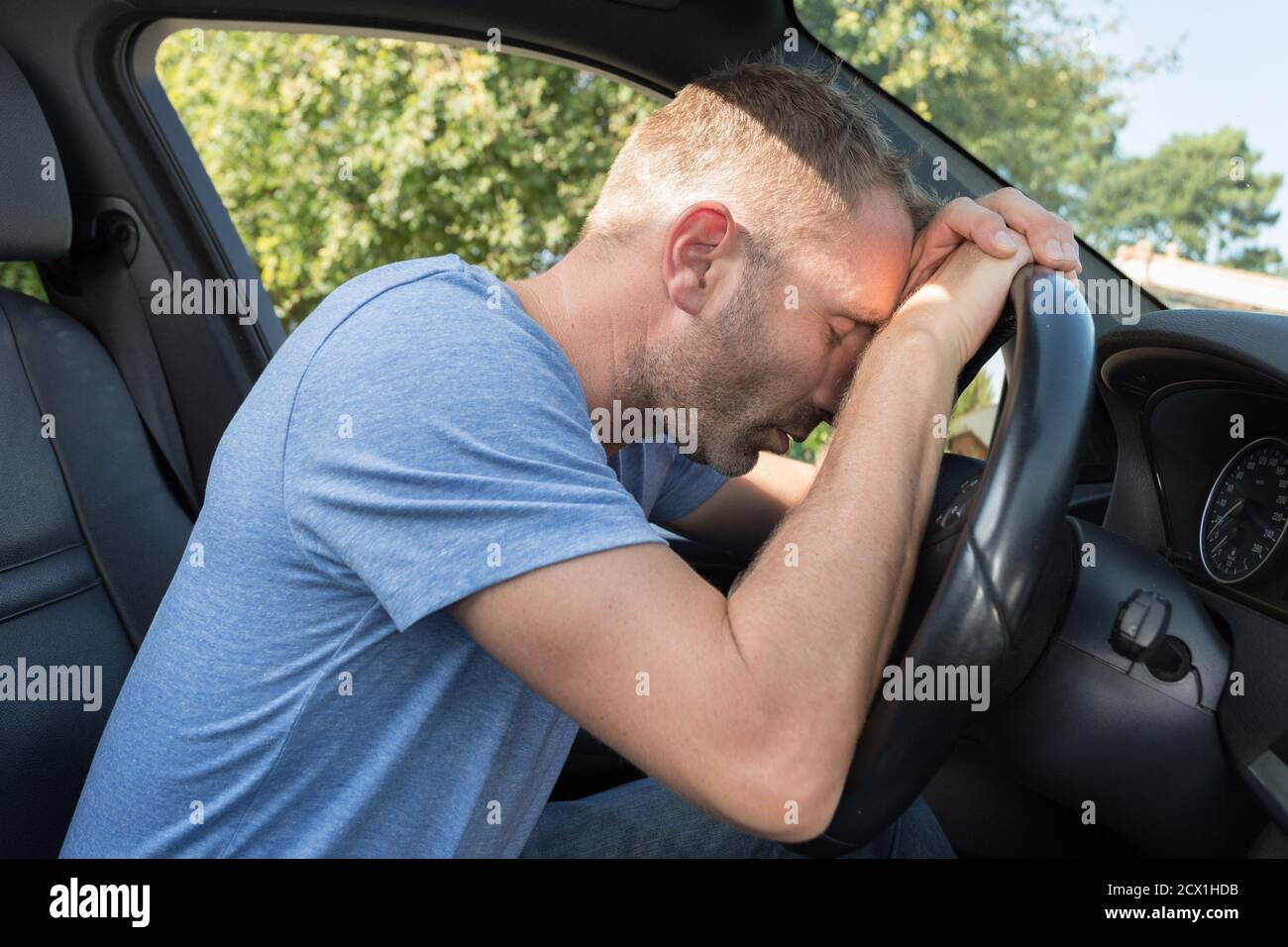 tired and drunk man driving attention Stock Photo - Alamy