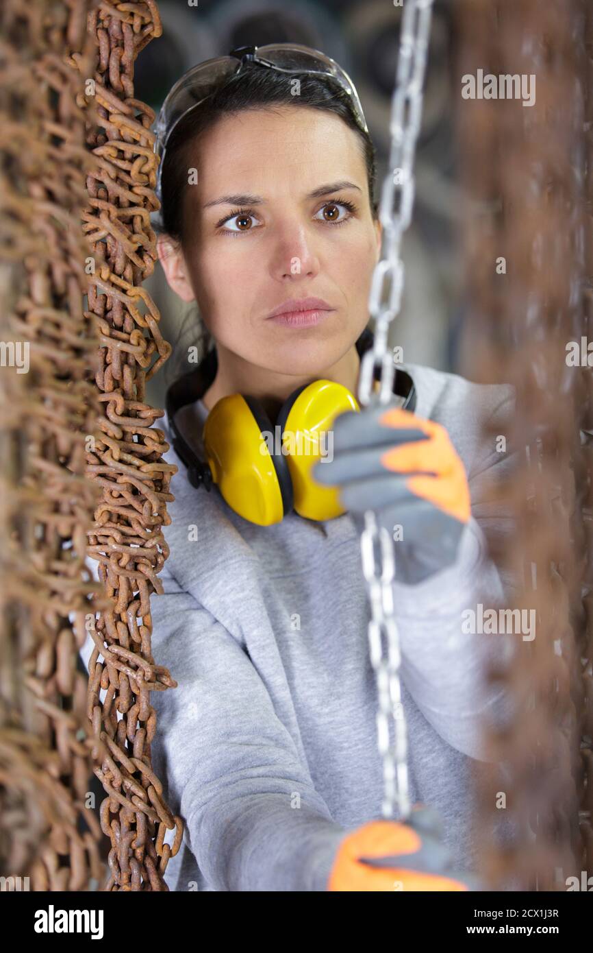 woman worker checking a construction chain Stock Photo - Alamy