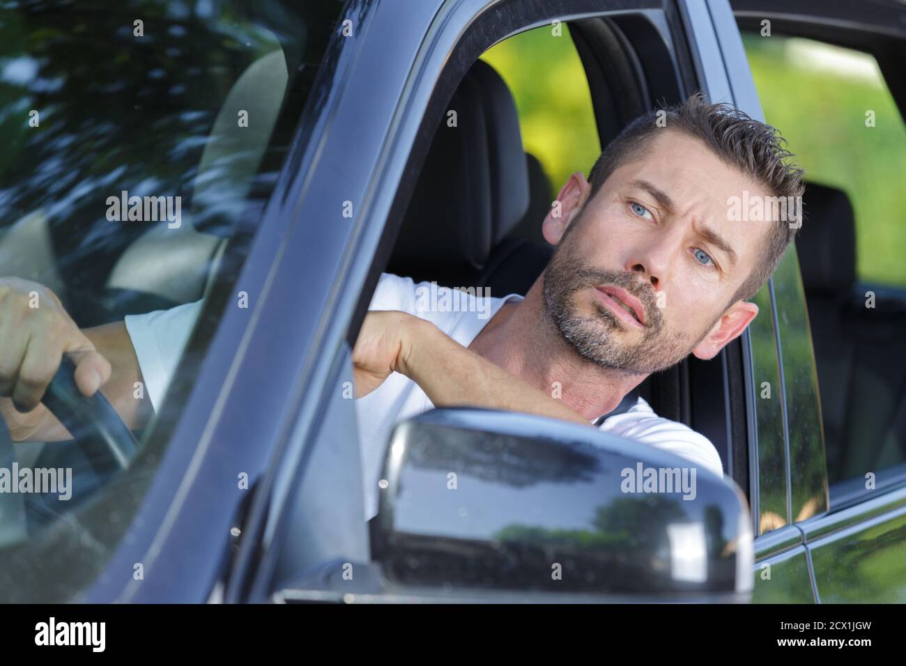 picture of male driver looking Stock Photo - Alamy