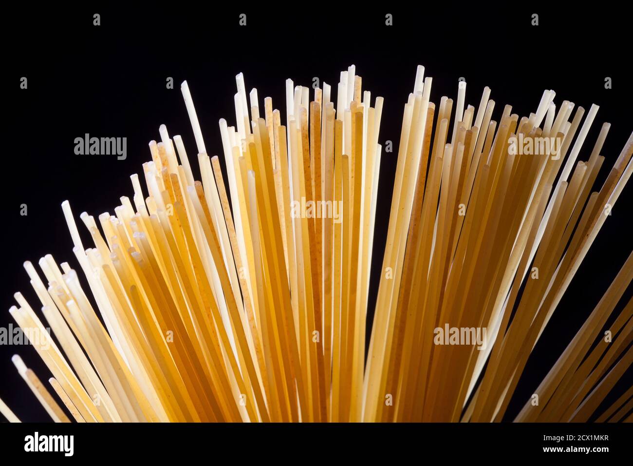Italian spaghetti stacked in creative way and backlighted Stock Photo ...