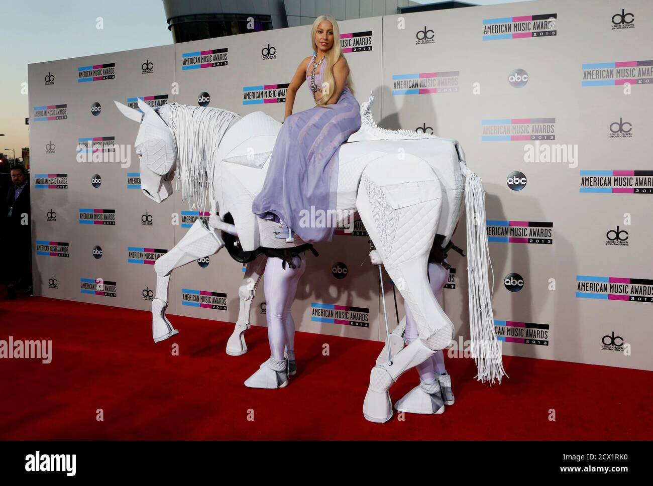 Lady in red dress riding a horse hi-res stock photography and images ...