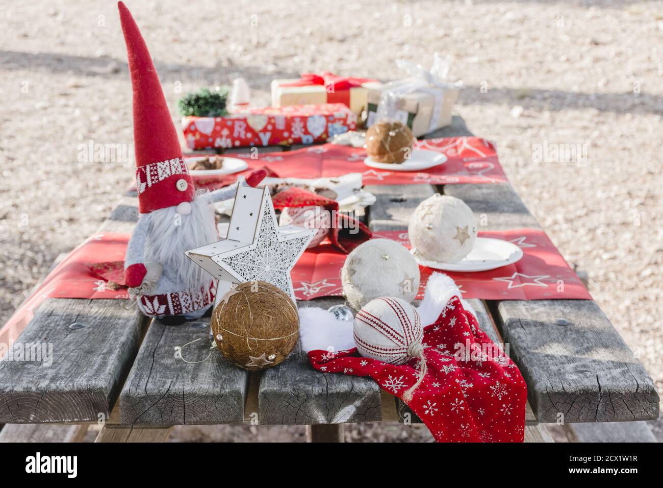 Christmas decorations on a picnic table in the countryside after a ...