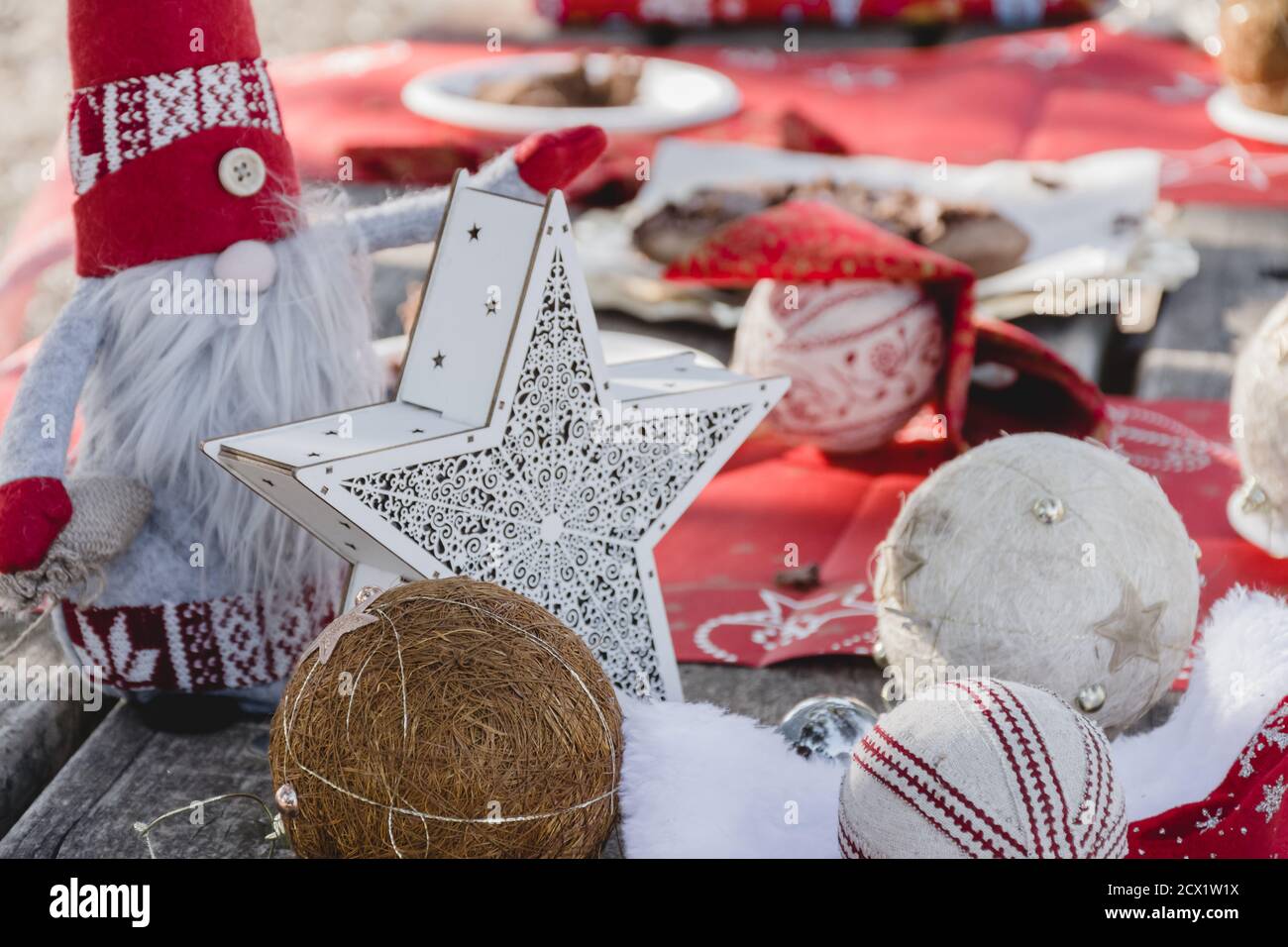Christmas decorations on a picnic table in the countryside after a ...