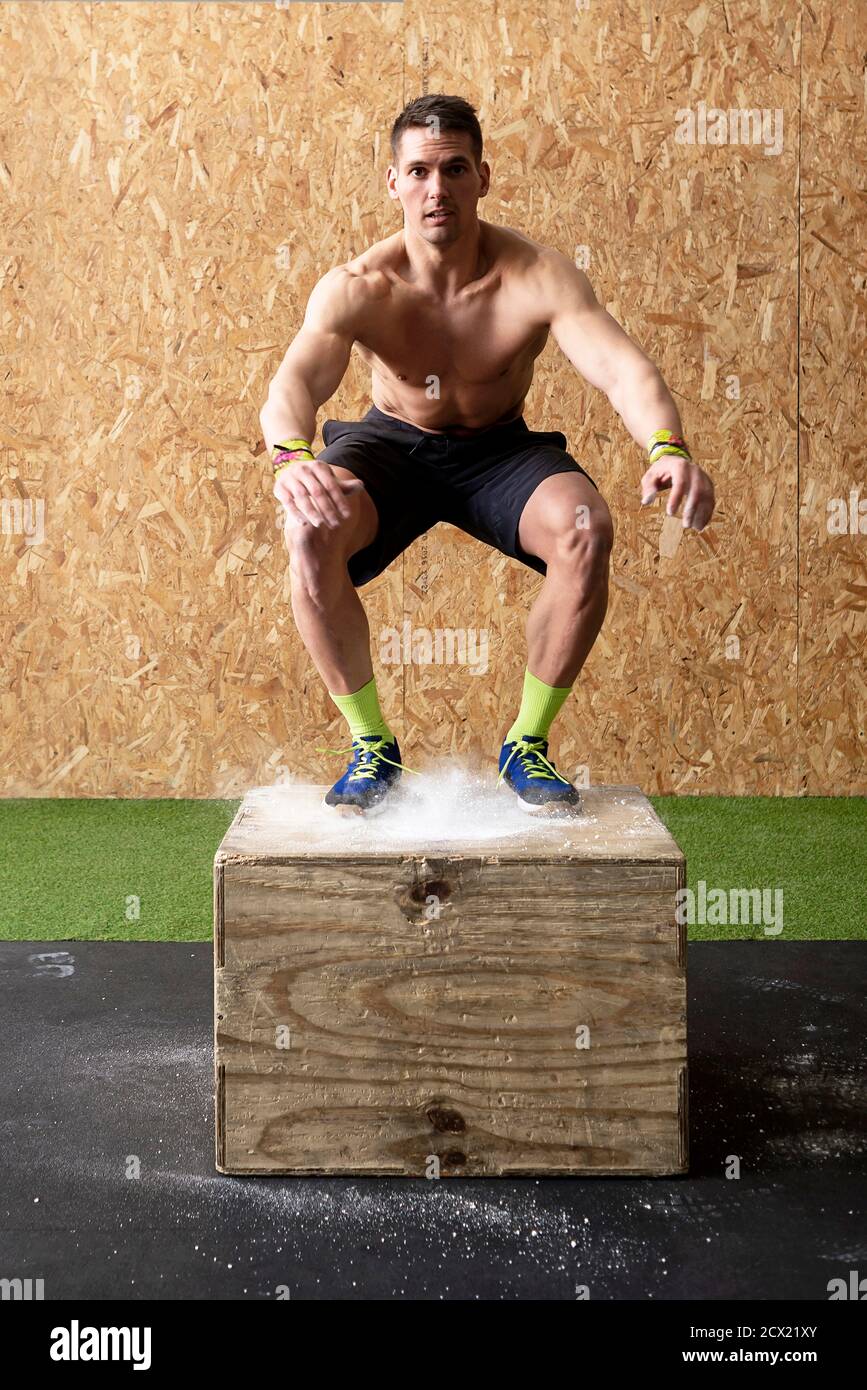 Young man jumping on box hi-res stock photography and images - Alamy