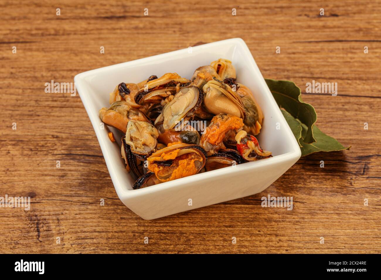 Pickled mussels with spices in the bowl Stock Photo - Alamy