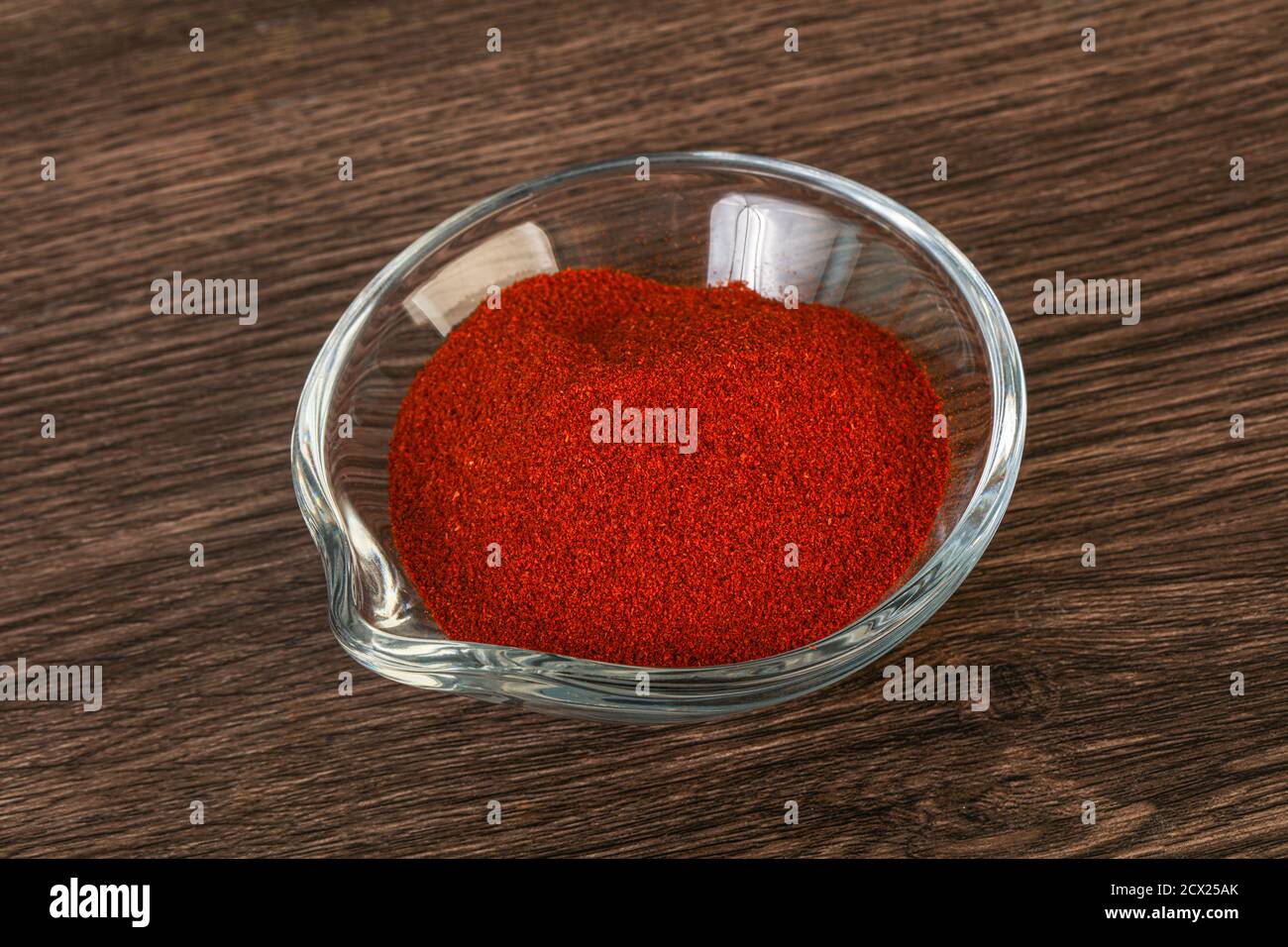 Dry paprika powder in the bowl for cooking Stock Photo - Alamy
