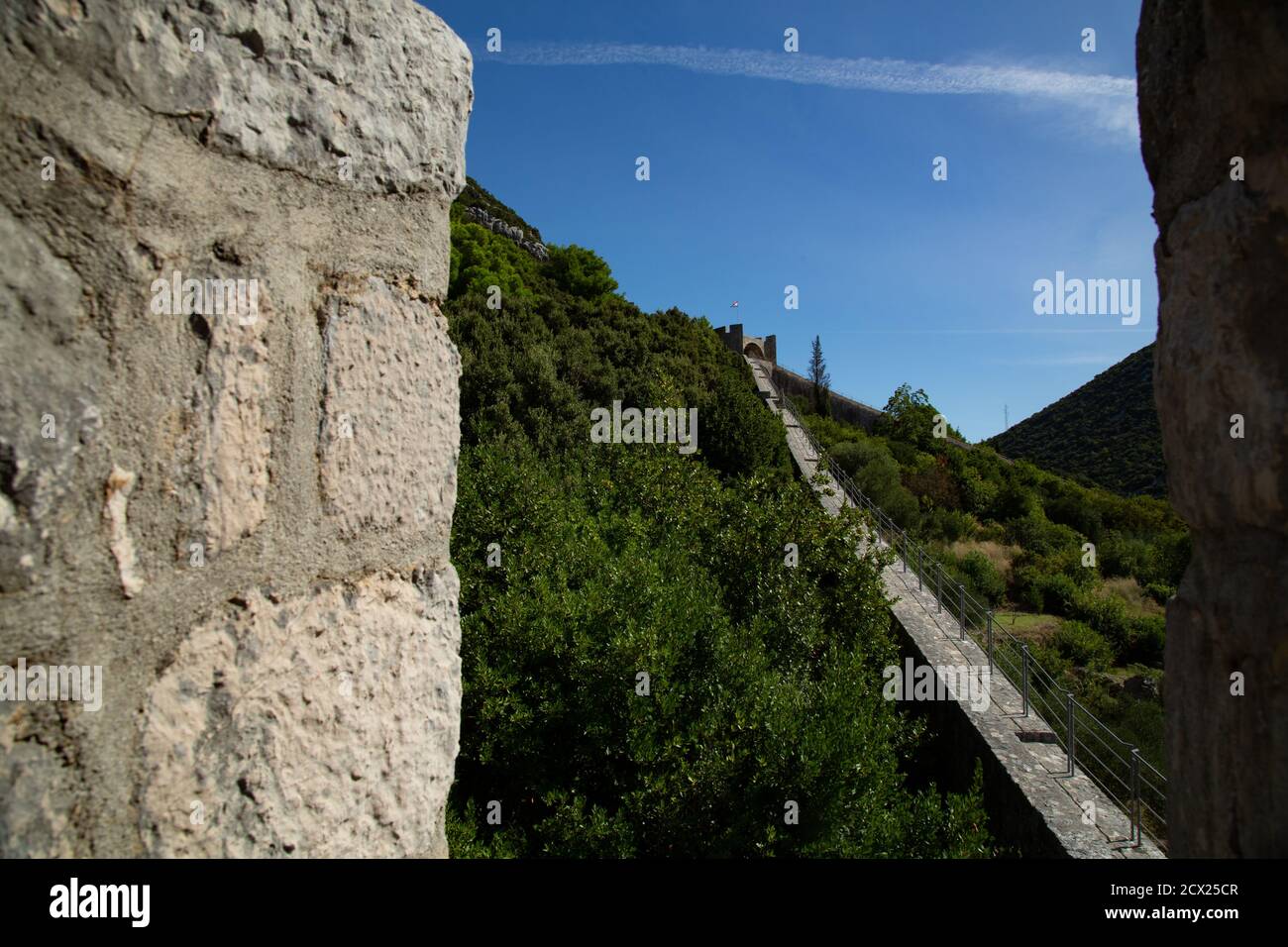 Stone wall built on mountain Stock Photo - Alamy