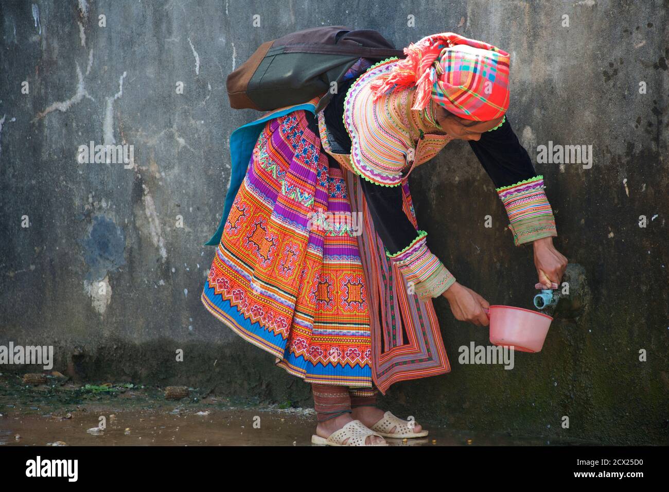 Hmong woman collecting water at Coc Ly market, near Bac Ha, Lao Cai ...