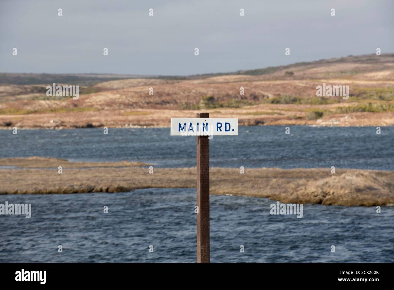Text on sign board against river Stock Photo - Alamy