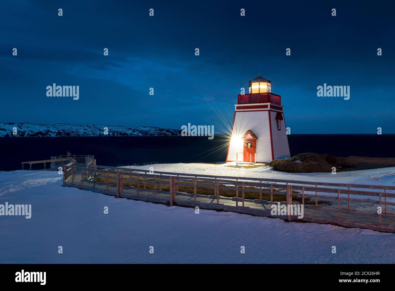 Illuminated lighthouse during winter at night Stock Photo - Alamy