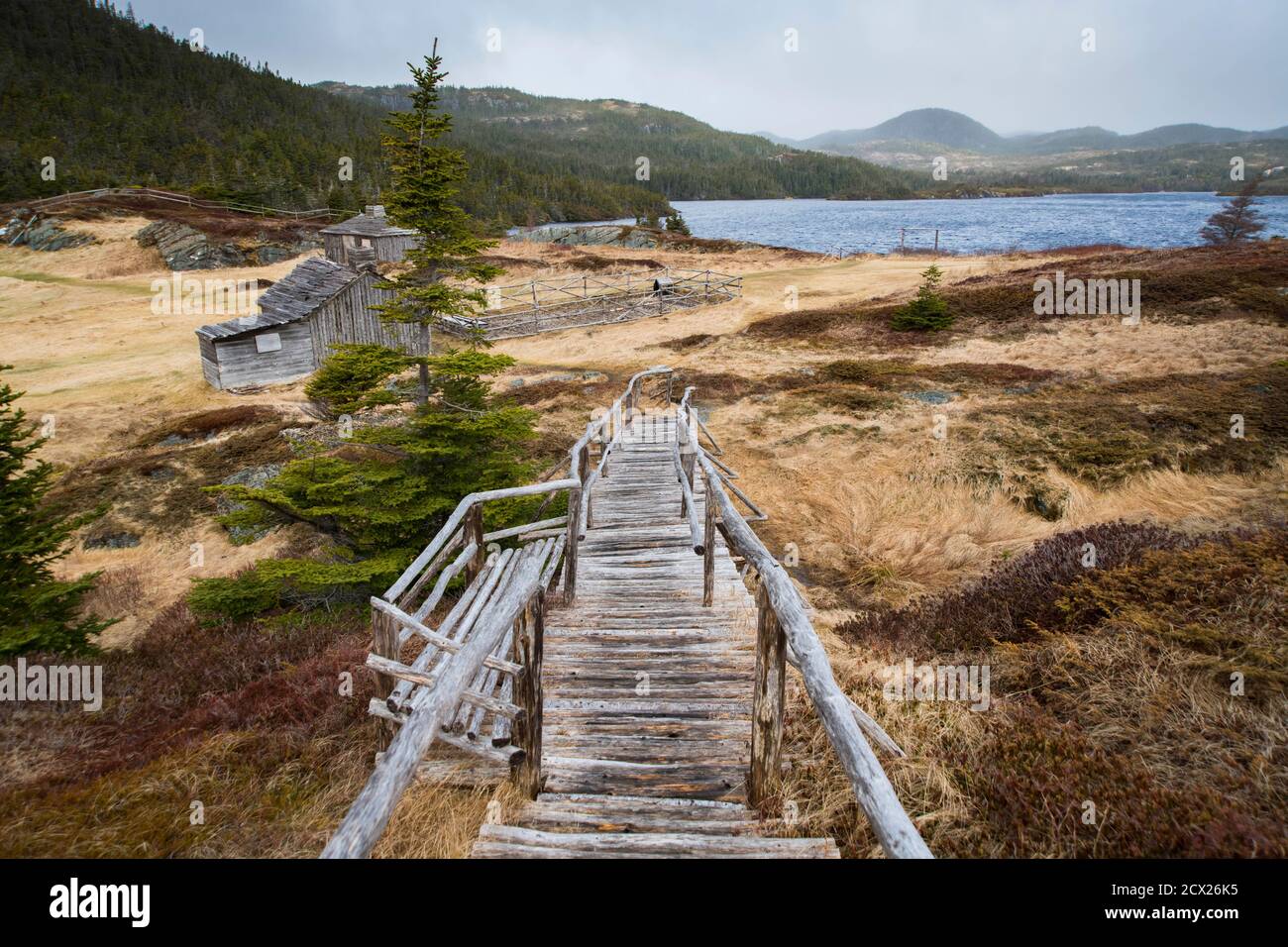 Old wooden footbridge over field Stock Photo - Alamy