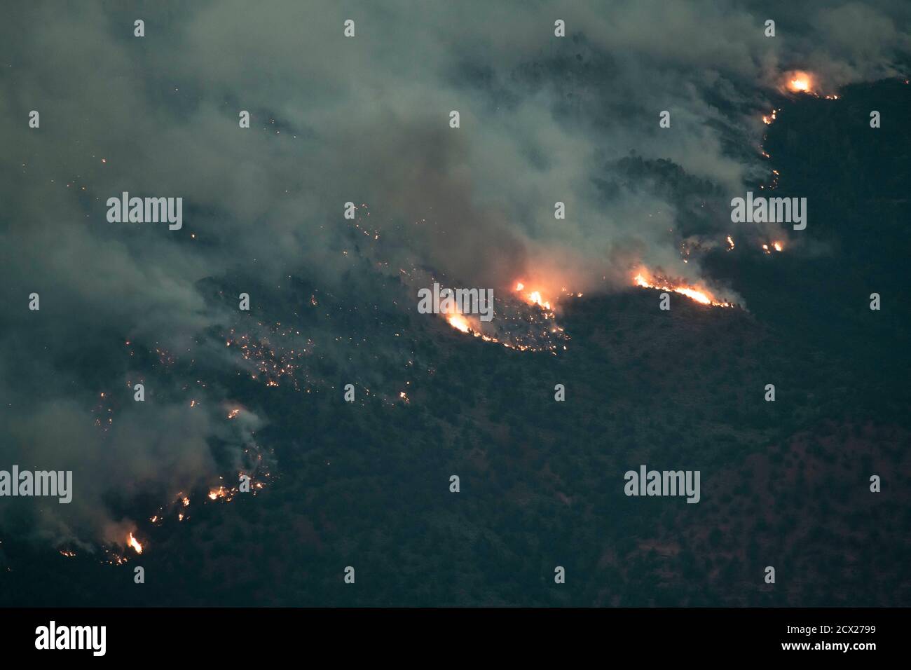 Aerial view of wildfire in forest at dusk Stock Photo - Alamy