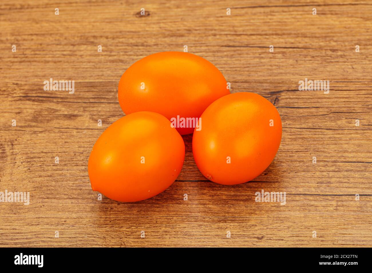 Tasty vegetables - Yellow tomato heap over background Stock Photo - Alamy