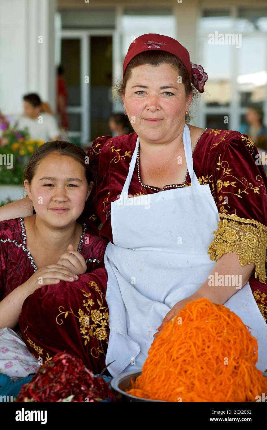 Uzbeki mother and daughter. Pickled vegetable vendors Samarkand market ...
