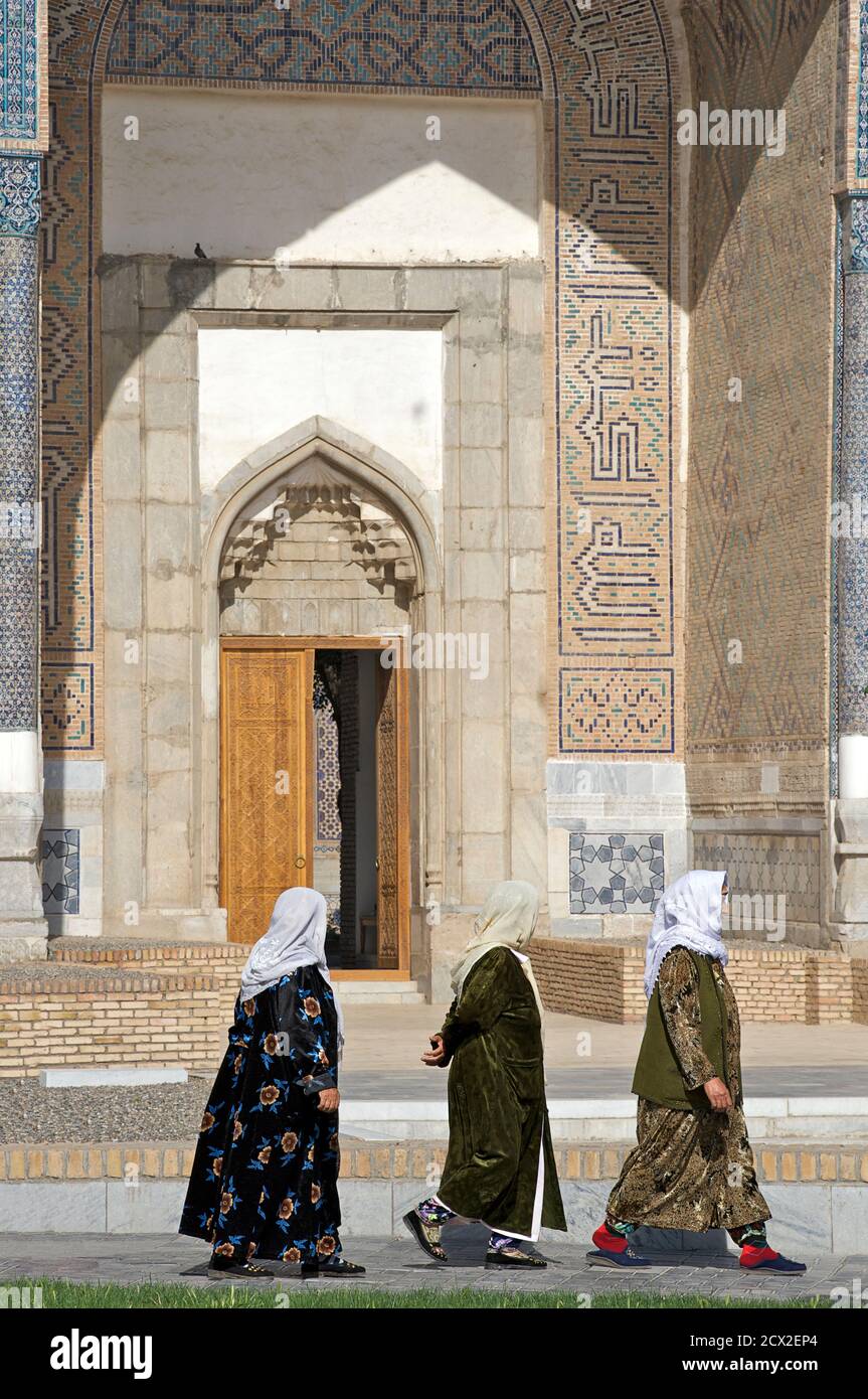 Uzbeki women in distinctive attire. Bibi Khanym Mosque, Samarkand ...