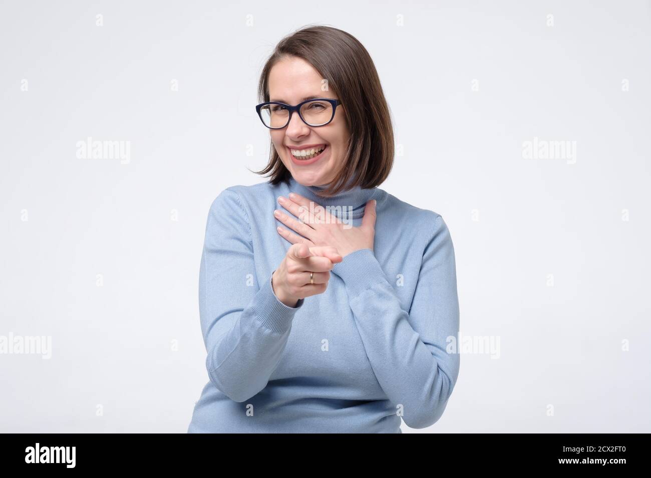Mature woman pointing and laughing at you Stock Photo - Alamy