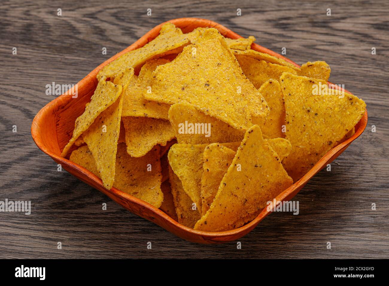 Mexican crunchy corn nachos triangle heap Stock Photo - Alamy