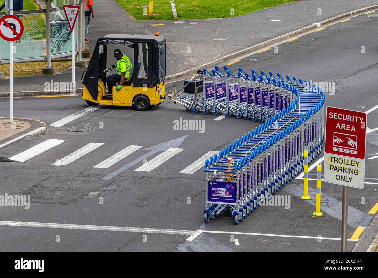 Auckland, New Zealand: A baggage cart mover is returning stray baggage ...
