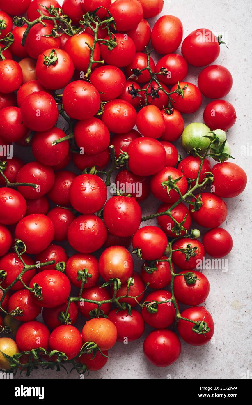 Fresh cherry tomatoes on the vine, top view Stock Photo - Alamy