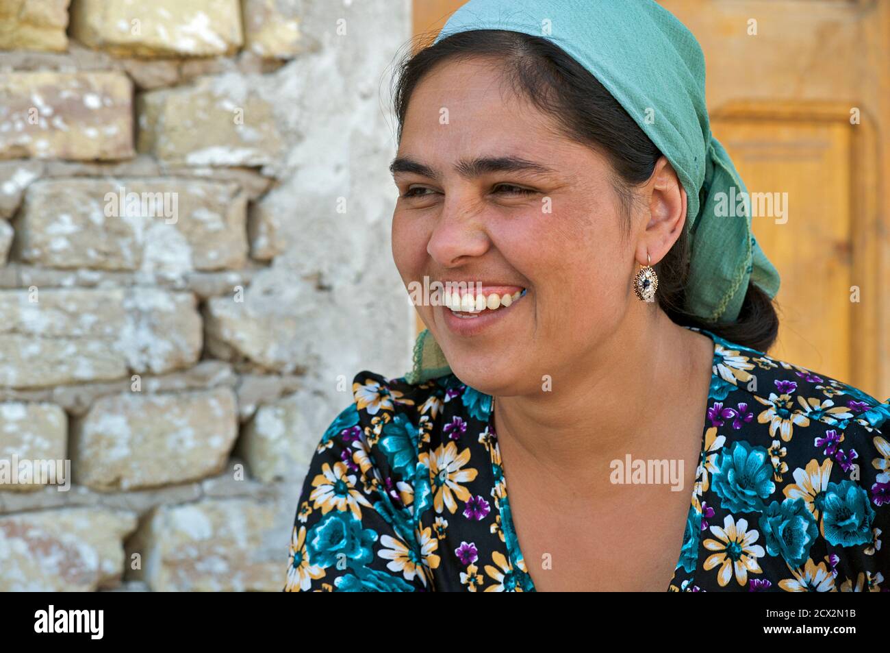 Portrait of a smiling Uzbeki woman in Uzbeki attire, Khiva, Uzbekistan ...