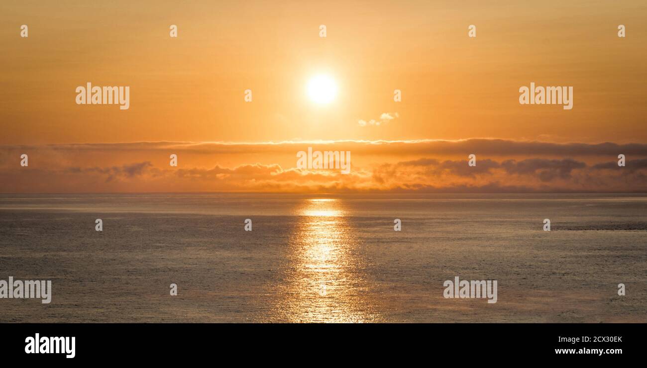 Sunrise on the Irish ocean just off to coast of Ireland Stock Photo - Alamy