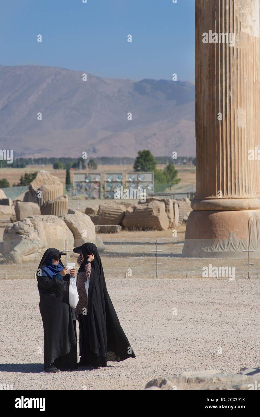 Iranian women wearing black chador at Persepolis, Iran Stock Photo - Alamy
