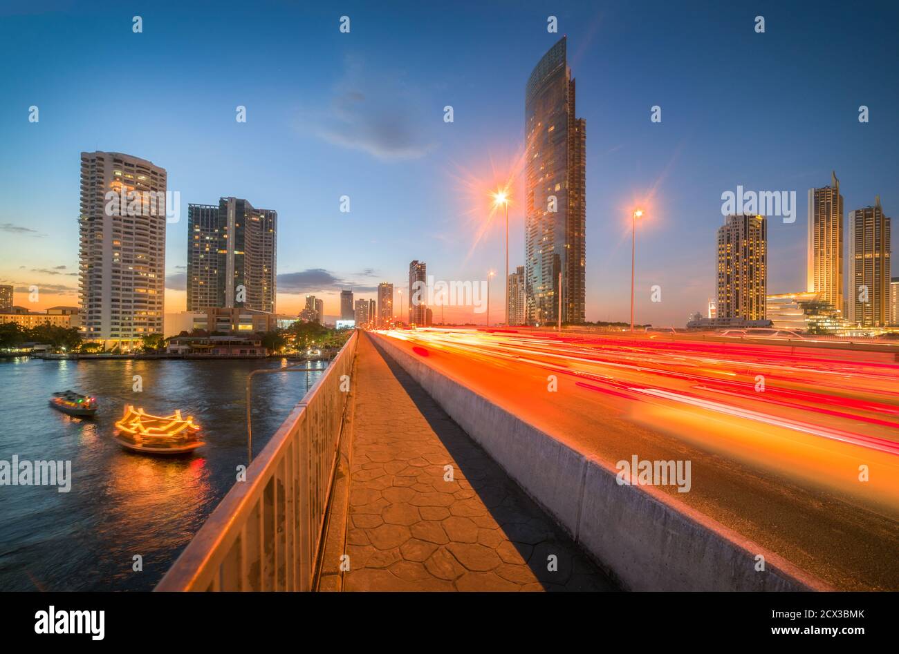 Skyscrapers and Traffic Light Trails on Taksin Bridge Crossing Chao ...