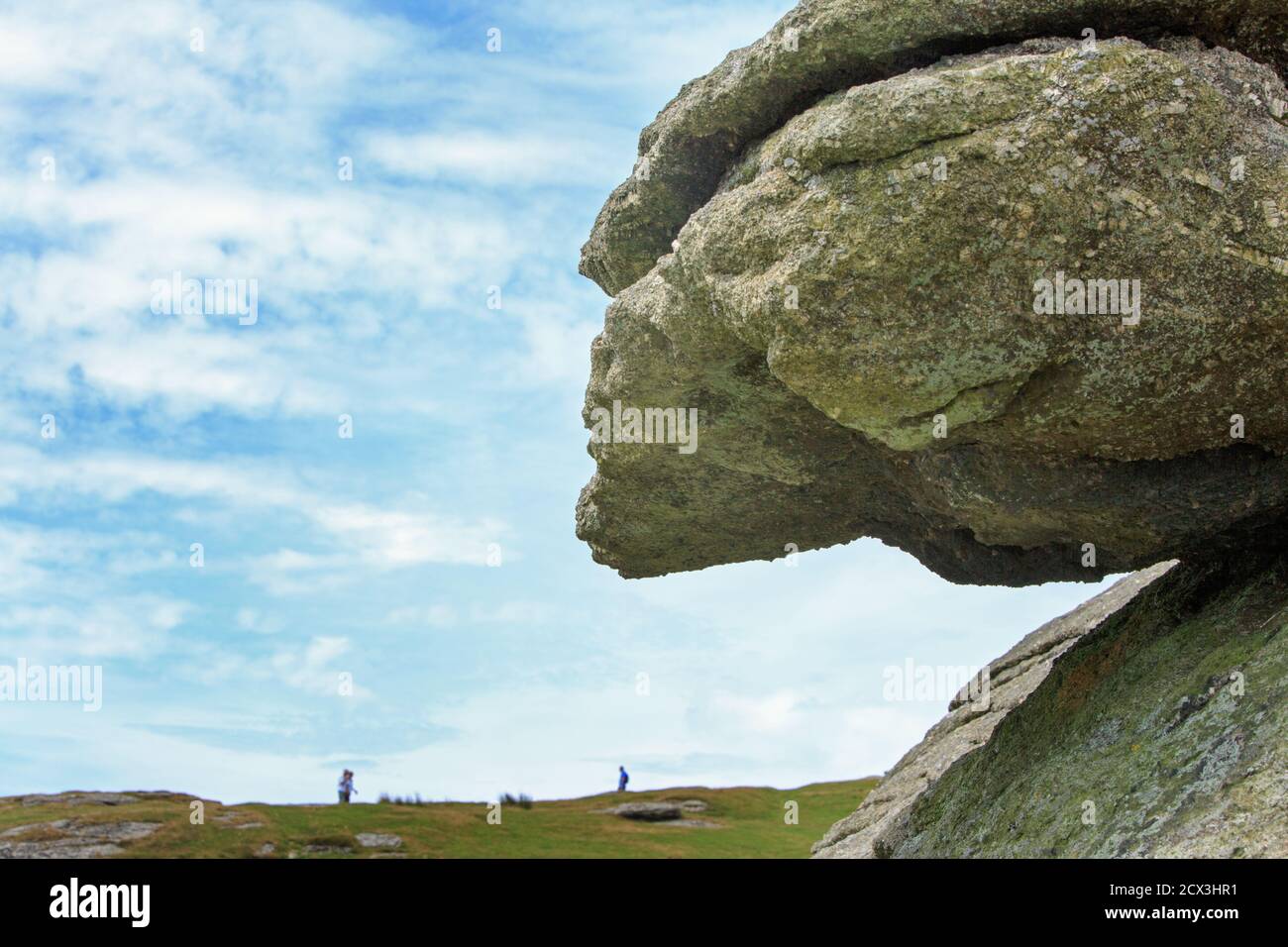 A Large Boulder on Haytor Rock Balancing with a landscape background ...