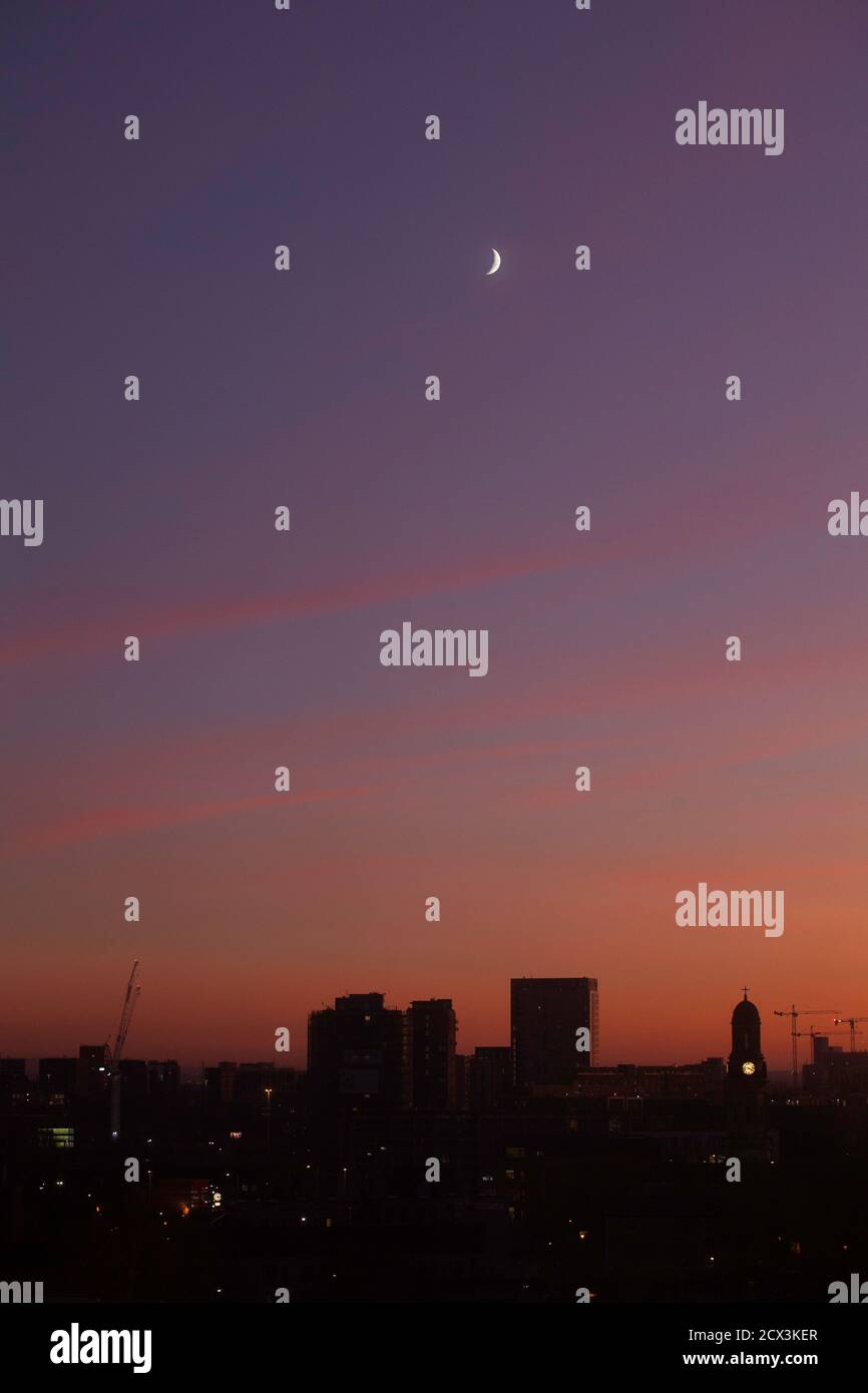 Crescent Moon and beautiful sunset sky above Manchester Salford and ...