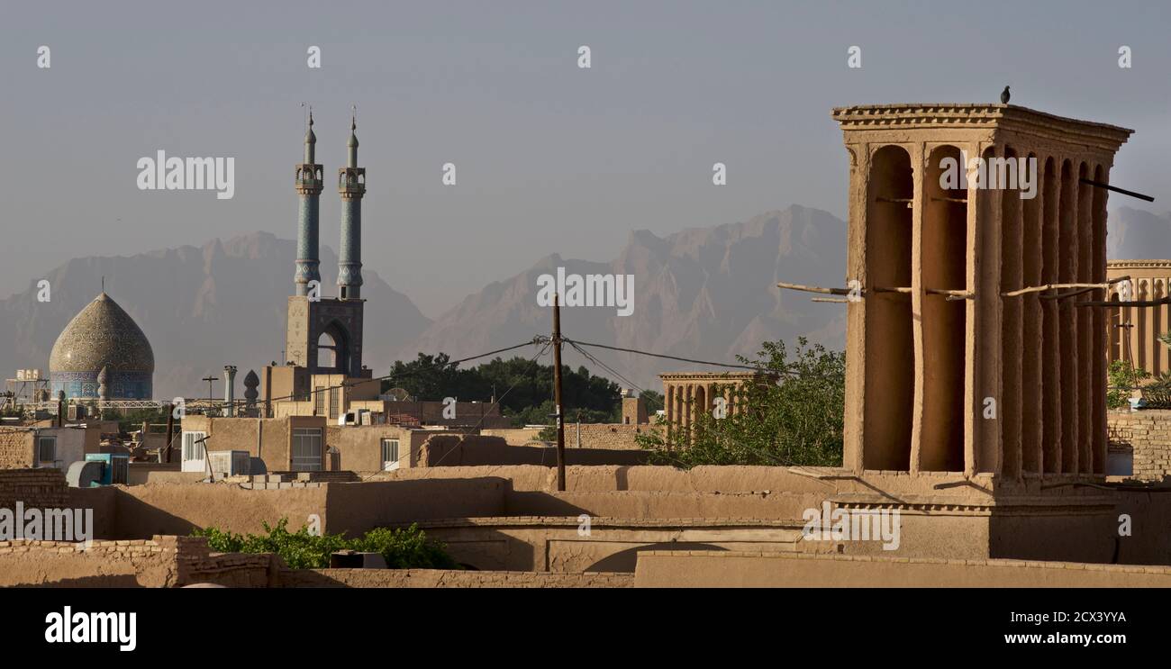 Rooftop scene across Yazd including the Friday mosque and a traditional ...