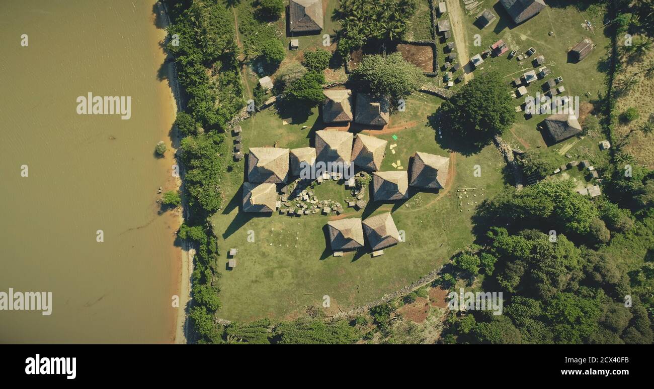 Aerial top down tropic countryside with ornately roofs cottages, houses ...