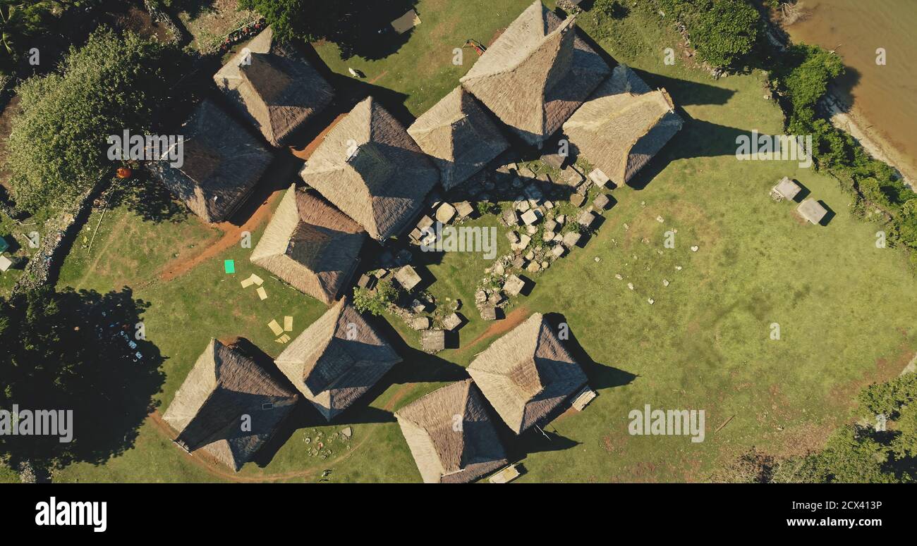 Aerial top down Indonesia farmland with ornated roofs houses at Kodi ...