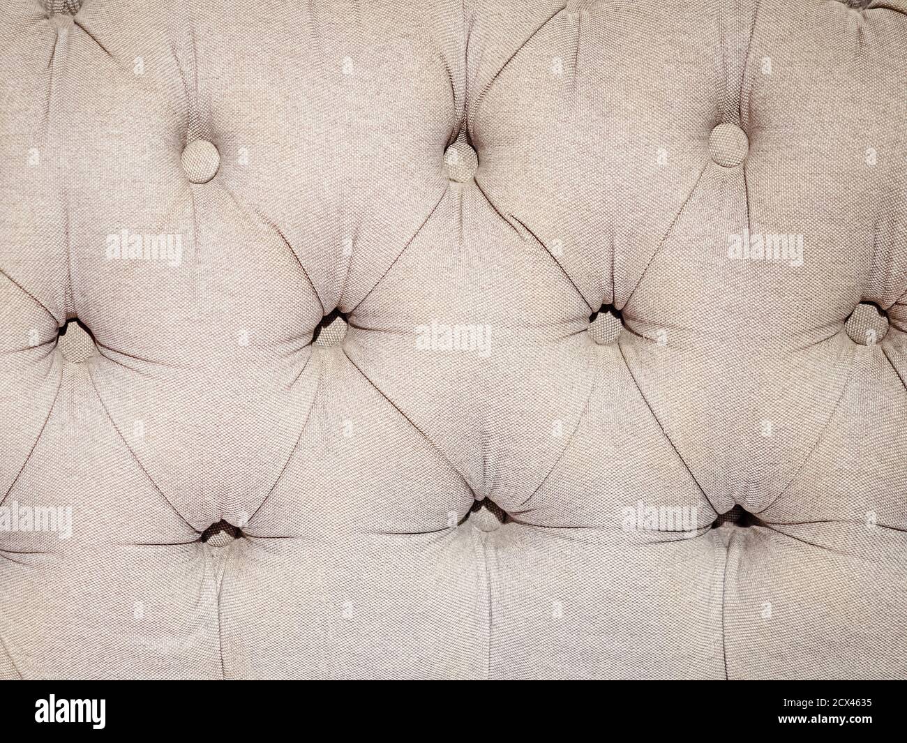 Light fabric quilted backrest with buttons. Full screen photo Stock ...
