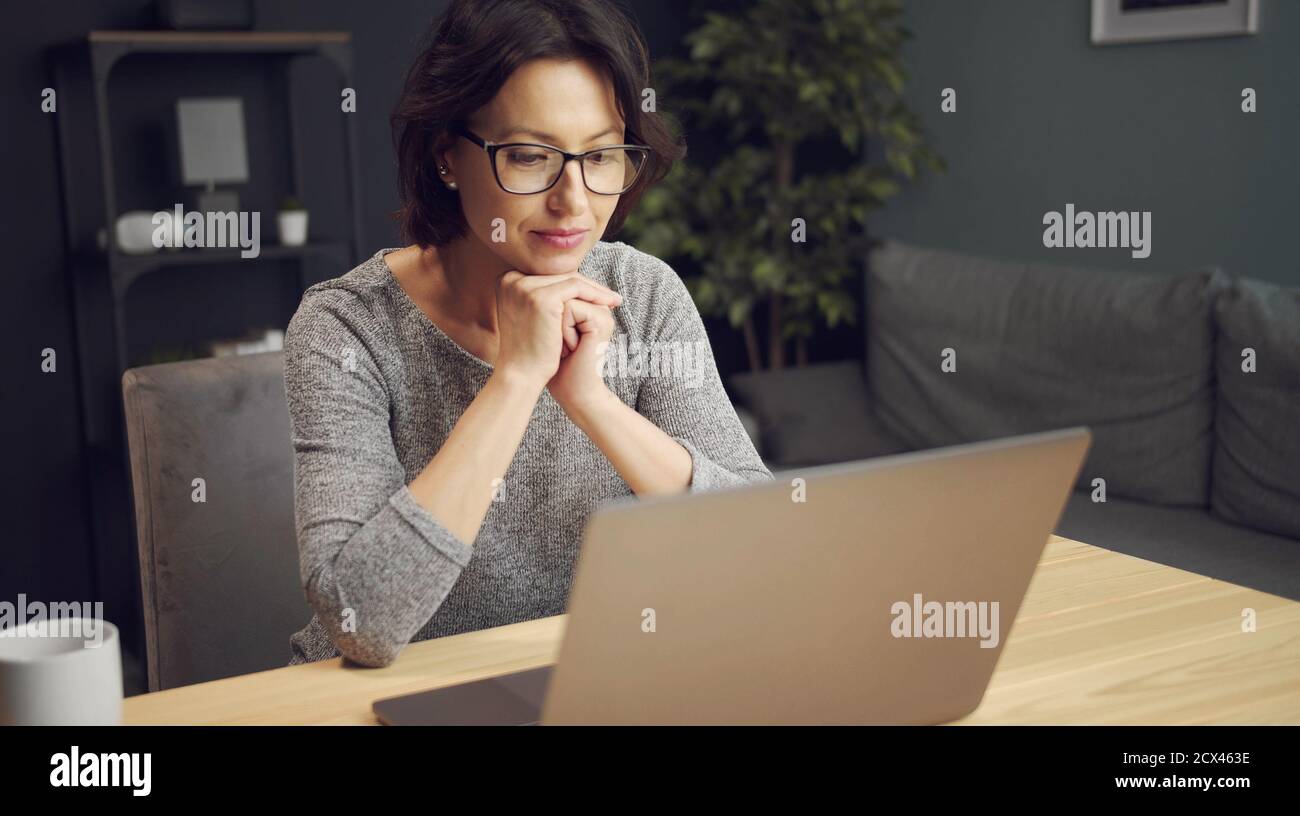 Positive young woman watching something hi-res stock photography and ...
