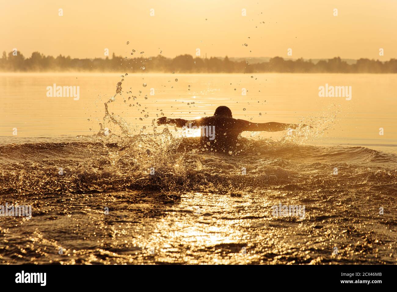 Fog lake man swim hi-res stock photography and images - Alamy