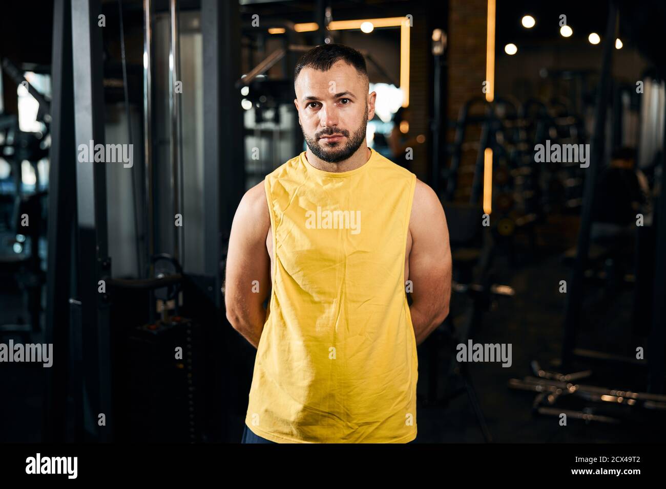 Standing man in sleeveless hi-res stock photography and images - Alamy